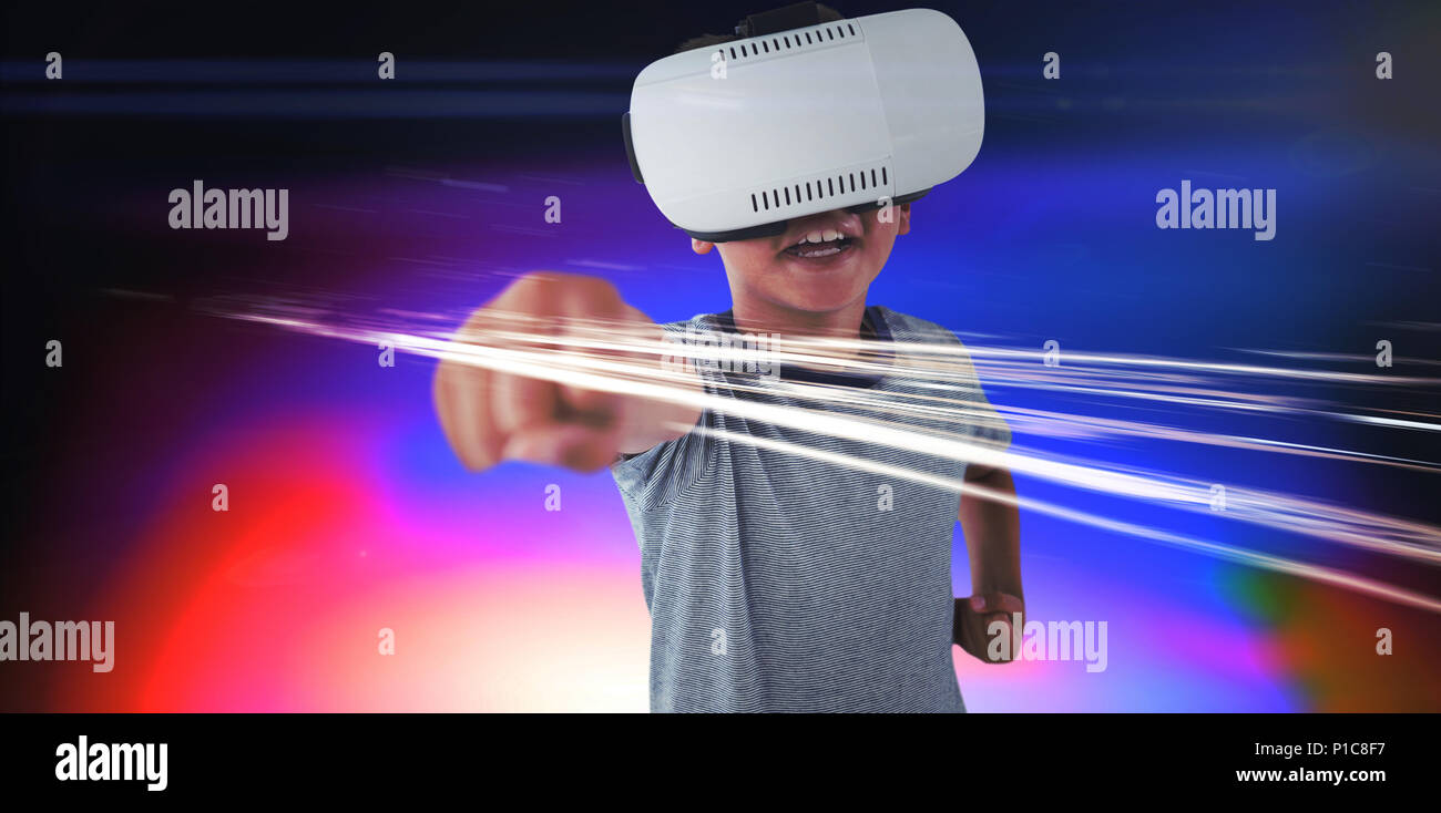 Smiling boy wearing virtual headset playing Stock Photo - Alamy
