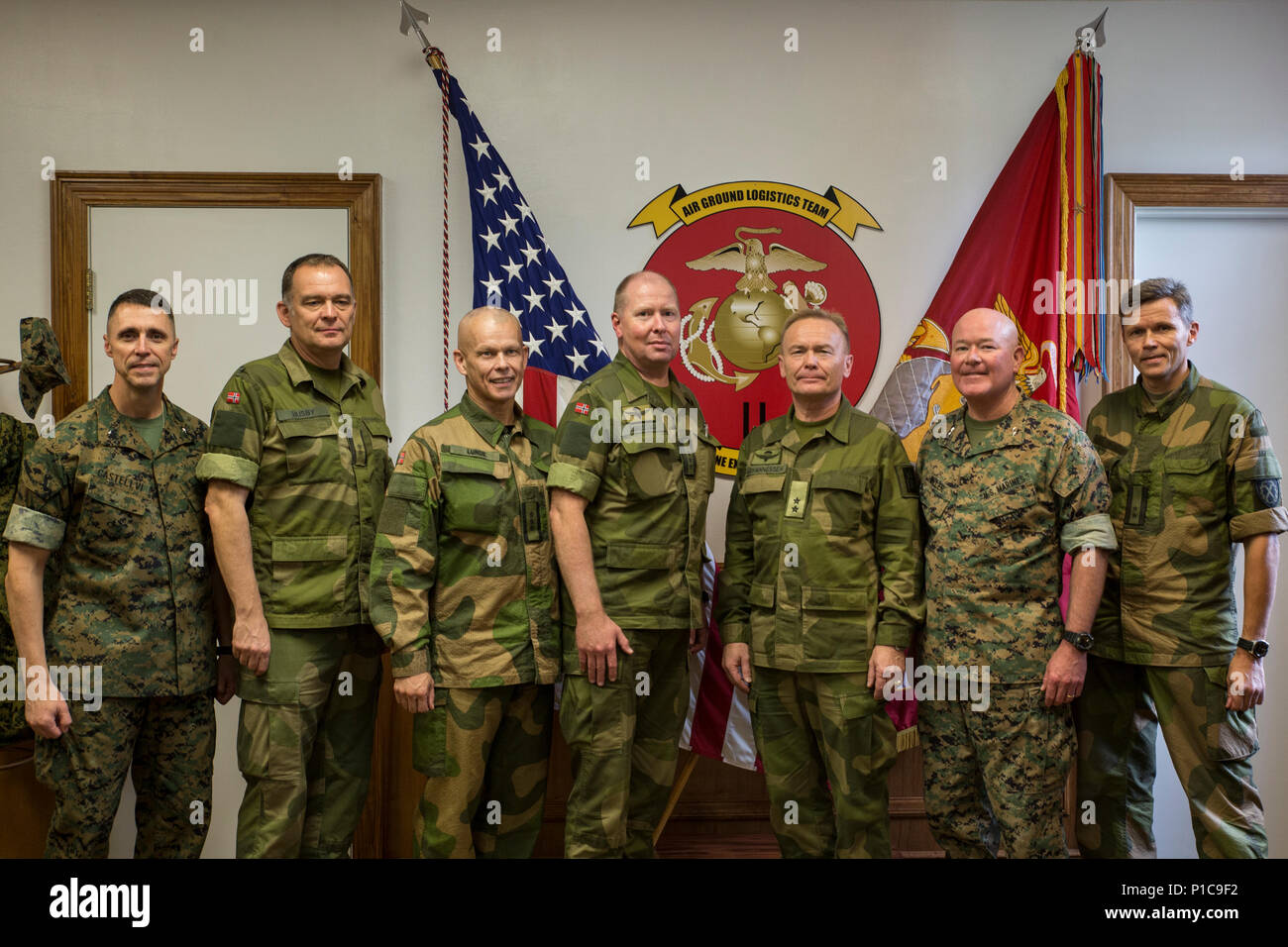 II Marine Expeditionary Force leaders pose for a photo with leaders of ...