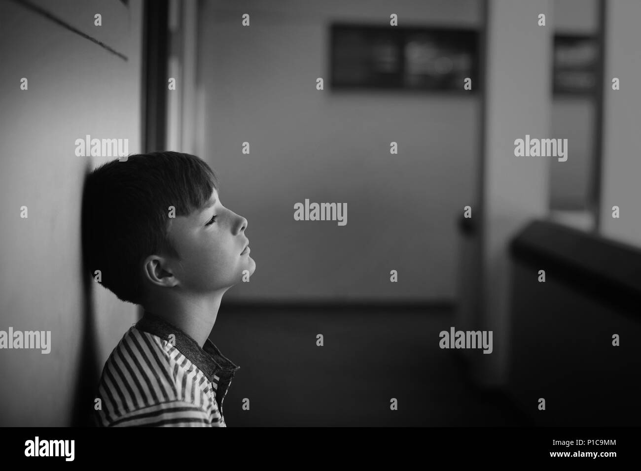 Boy leaning head back hi-res stock photography and images - Alamy