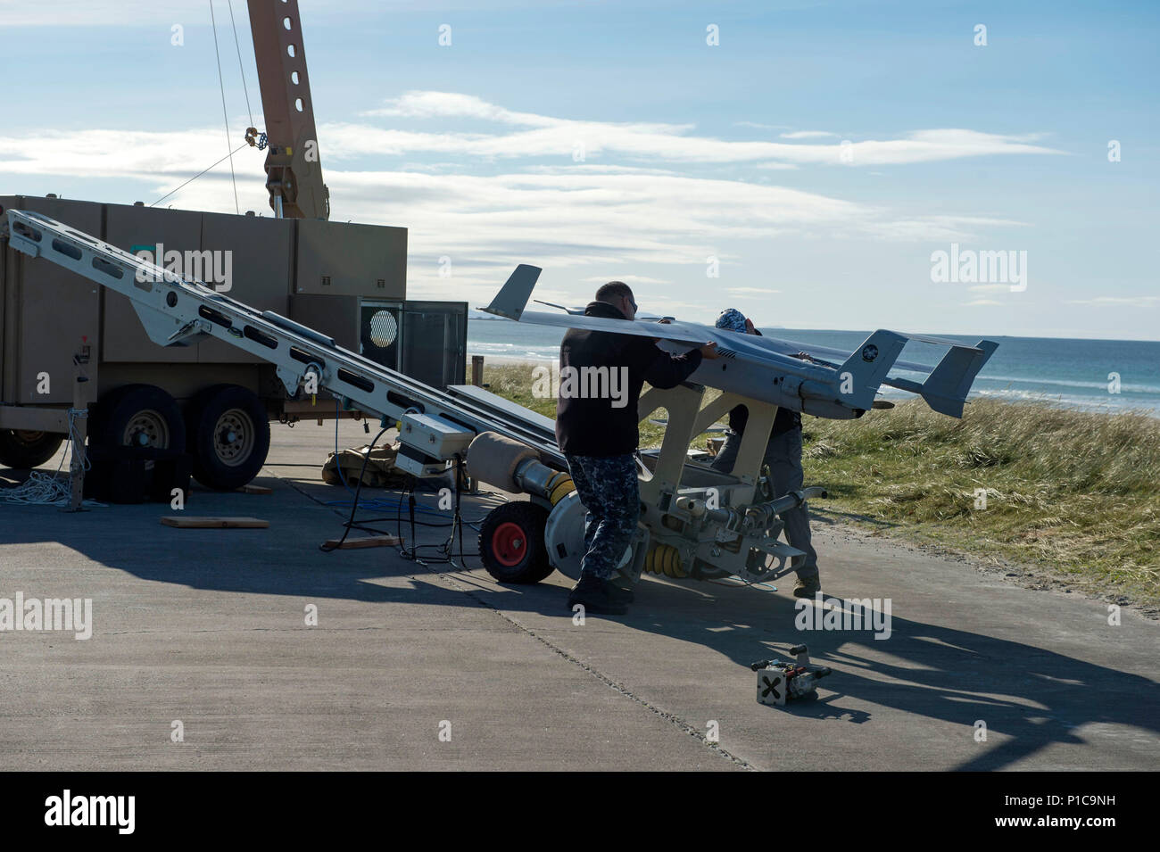 U.S. Navy personnel prepare an NRQ-21A Integrator unmanned aerial ...