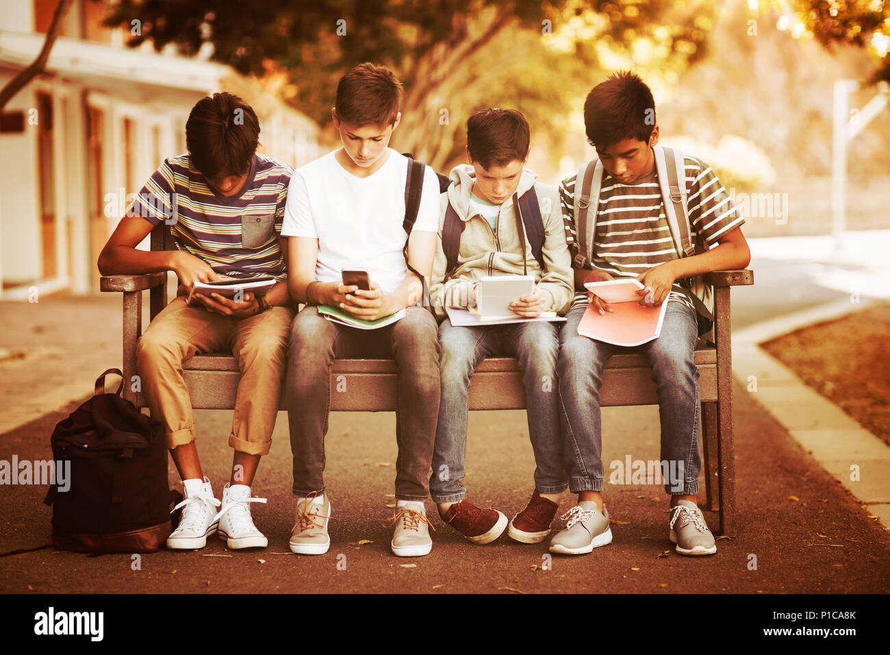 Boys with phones and tablets Stock Photo - Alamy