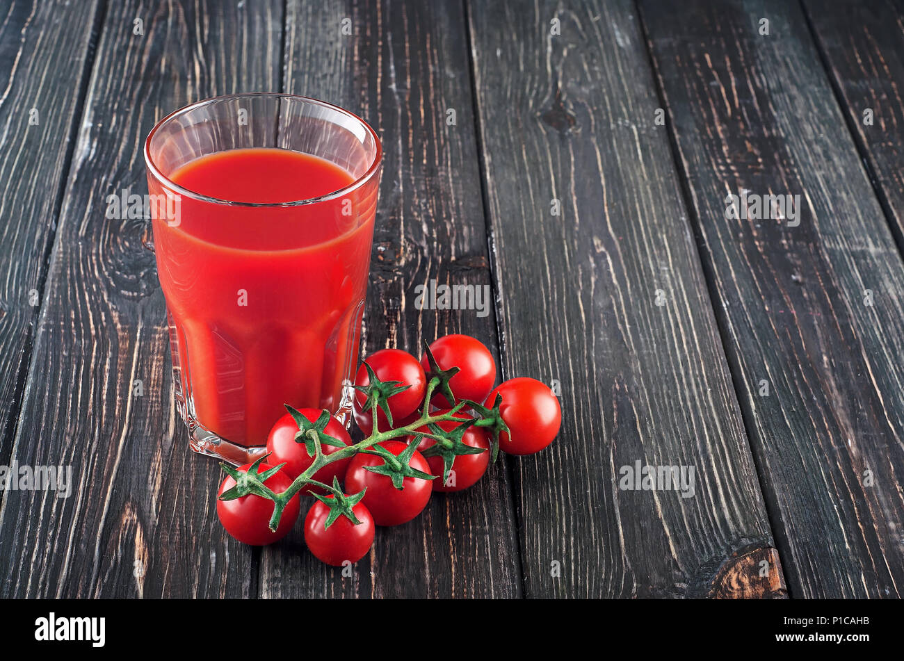 Tomato juice and cherry tomatoes Stock Photo - Alamy