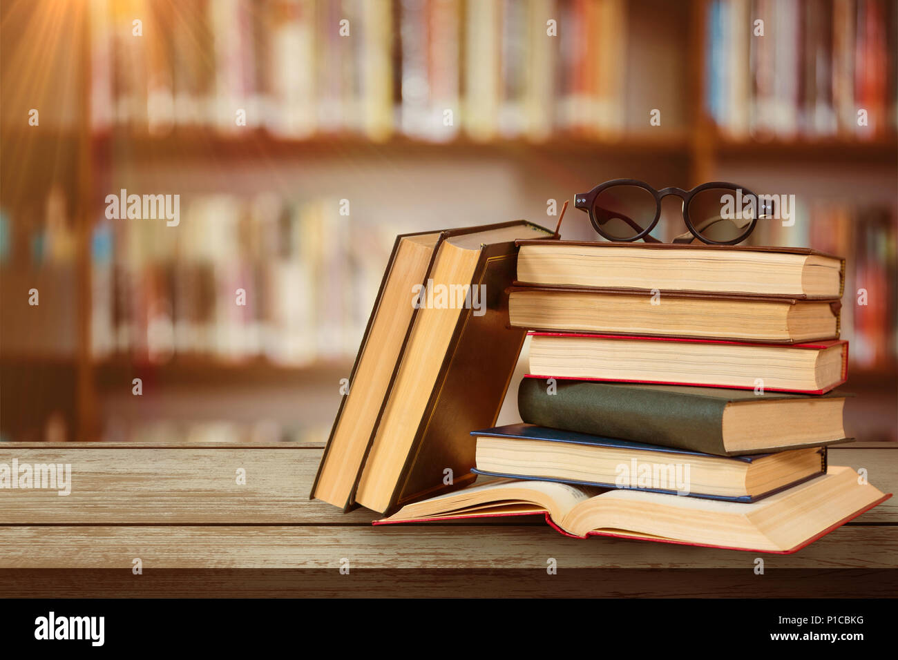 Books and eyeglasses hi-res stock photography and images - Alamy