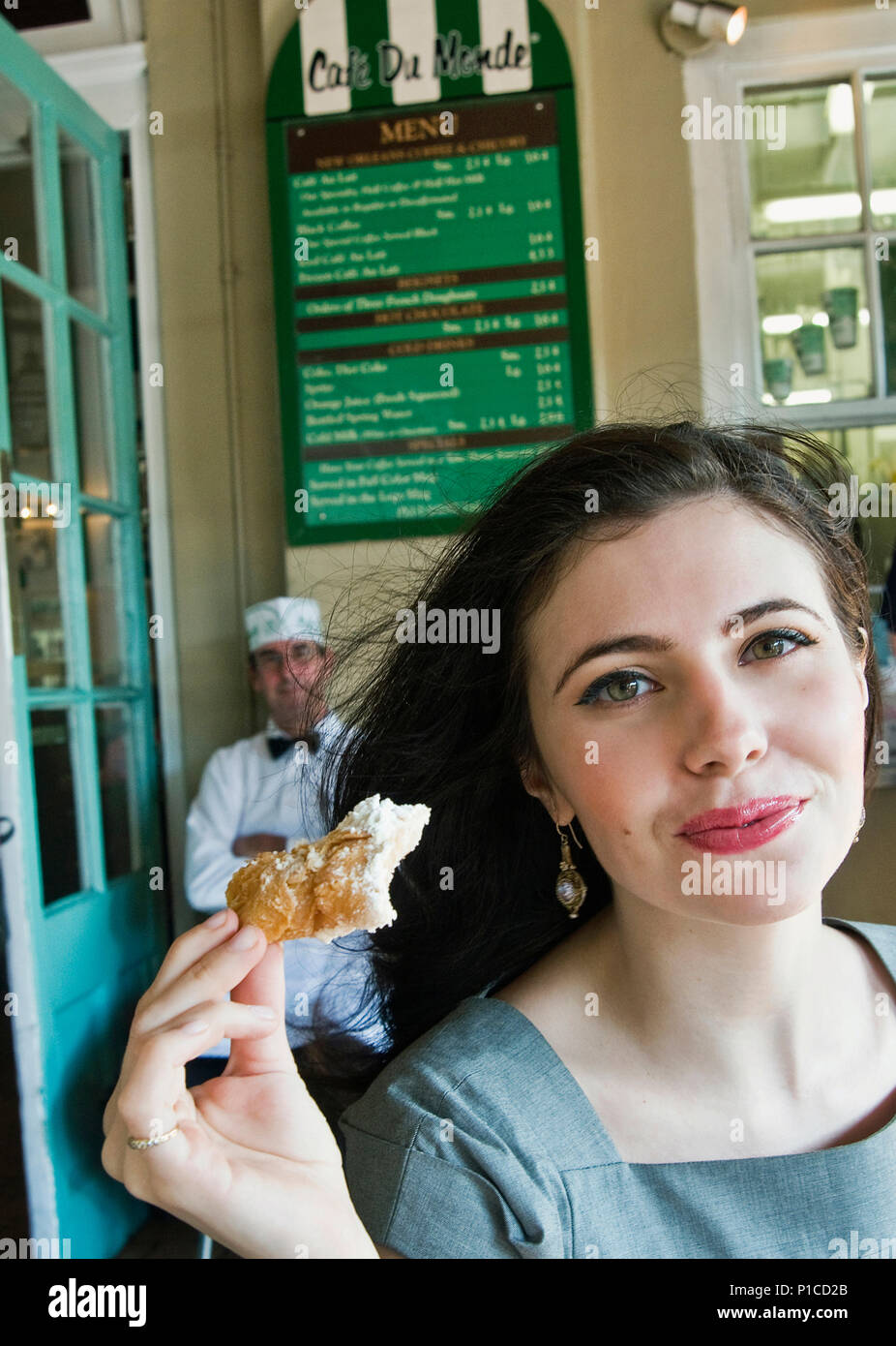 Person eating beignet hi-res stock photography and images - Alamy