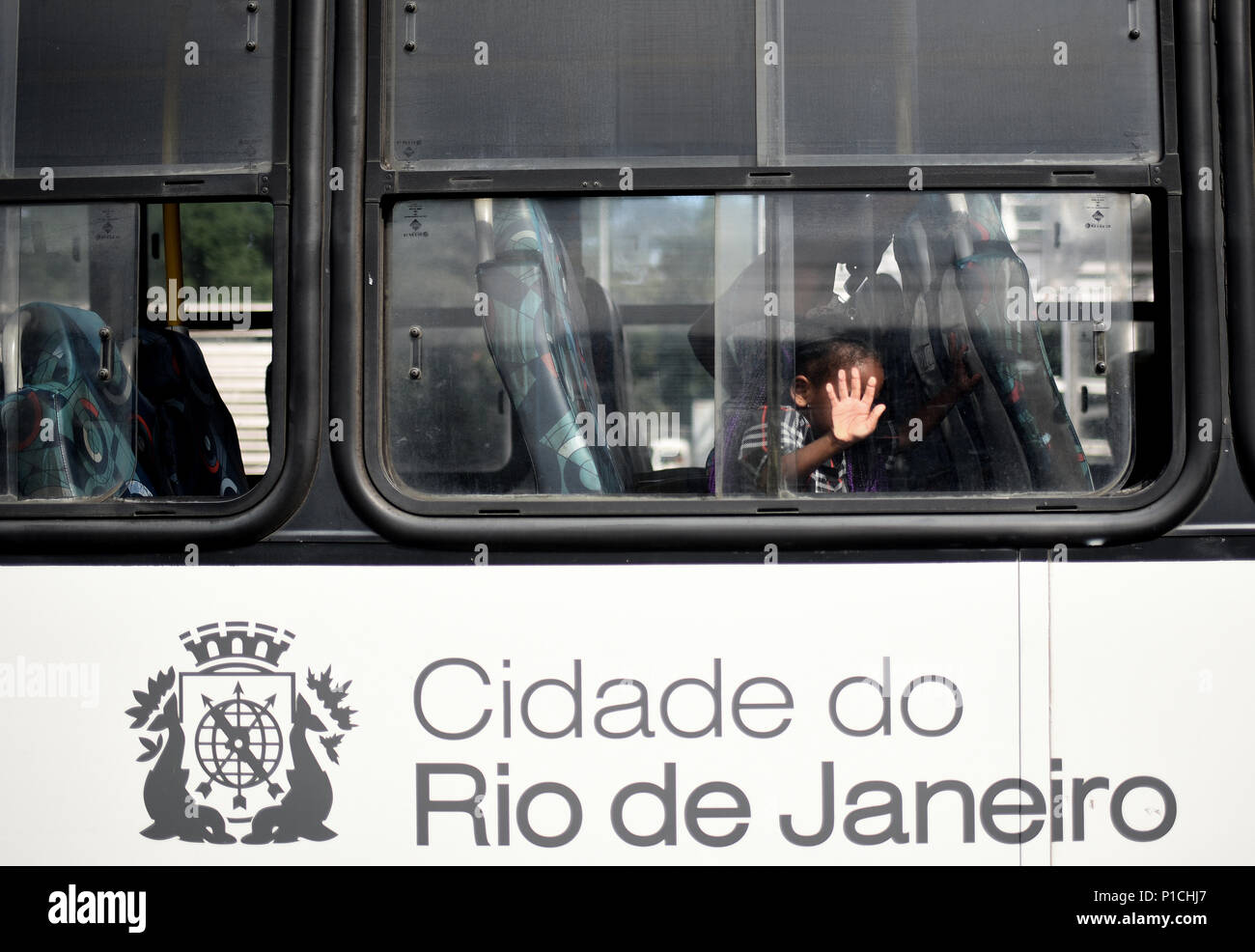 11 June 2018, Brazil, Rio de Janeiro: A child waits inside a bus after ...