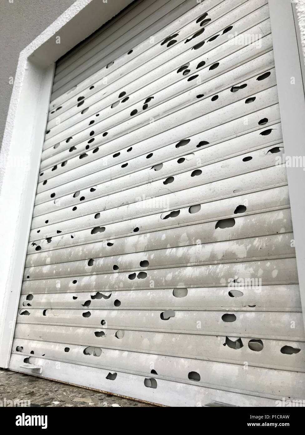 11 June 2018, Germany, Furth im Wald: Roller shutters damaged by by ...