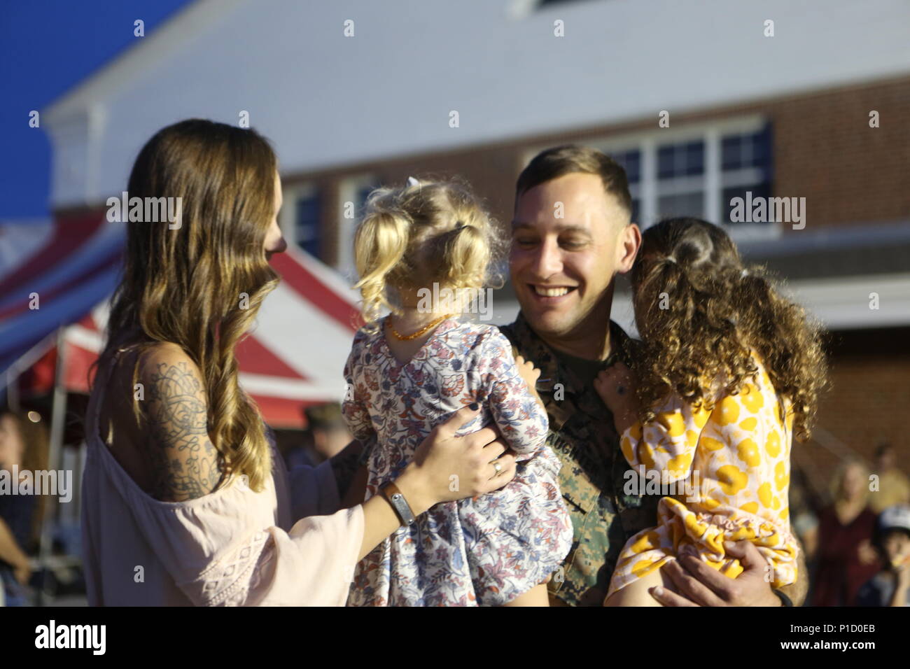 1st Lt. Marc Slaughter embraces family during a deployment homecoming ...