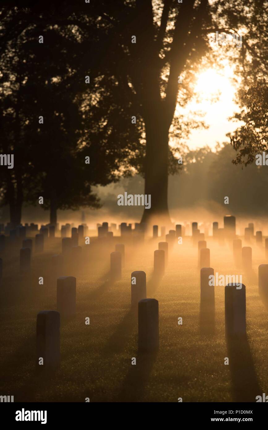 The low rising sun coupled with the fall colors of the trees blanket ...