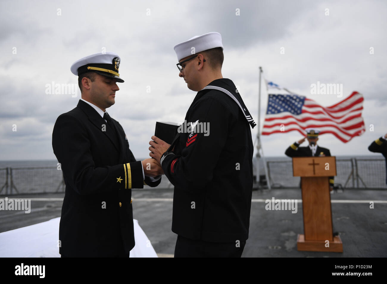 Sailors conduct a burial-at-sea ceremony aboard the Blue Ridge-class ...