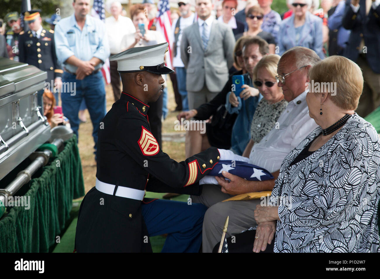 Staff Sgt. Anthony Baze, food service operations chief, Marine Forces Reserve, presents an ...