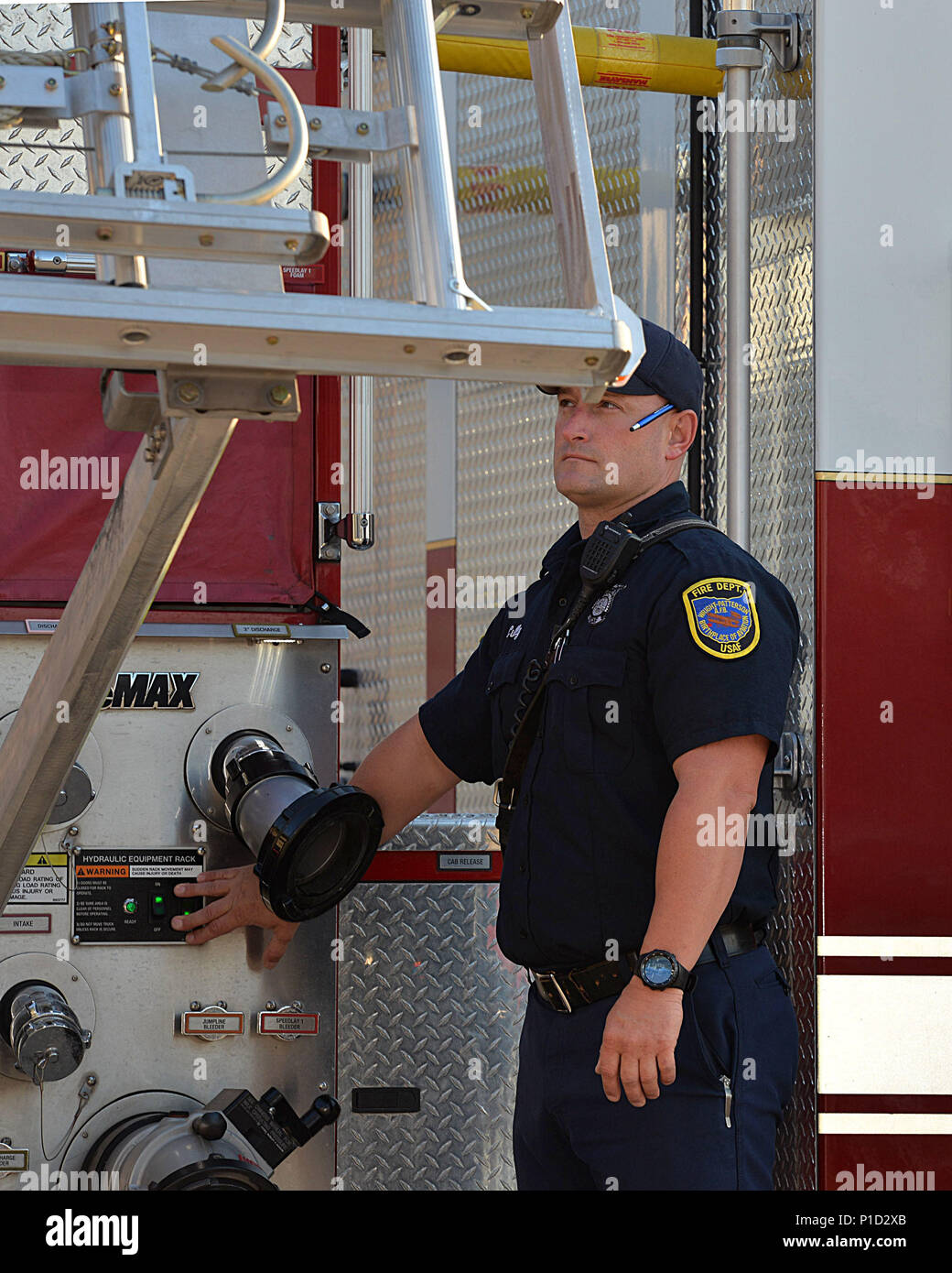 Benjamin Cully, 788th Civil Engineer Squadron firefighter, lowers the ...