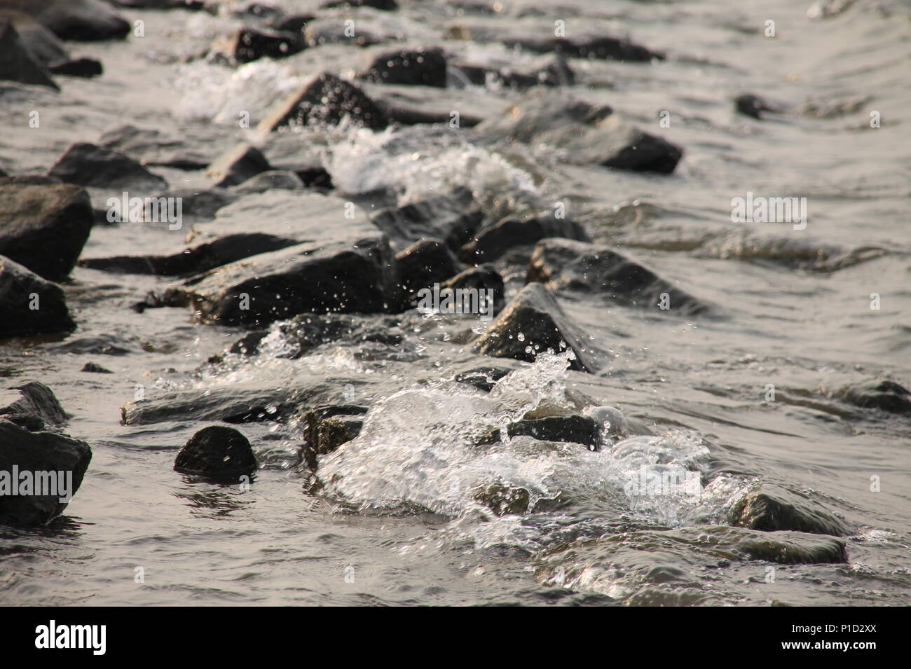 Water Splash on Stones Wallpaper Stock Photo - Alamy