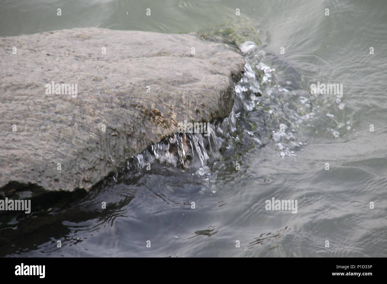 Water Splash on Stones Wallpaper Stock Photo - Alamy