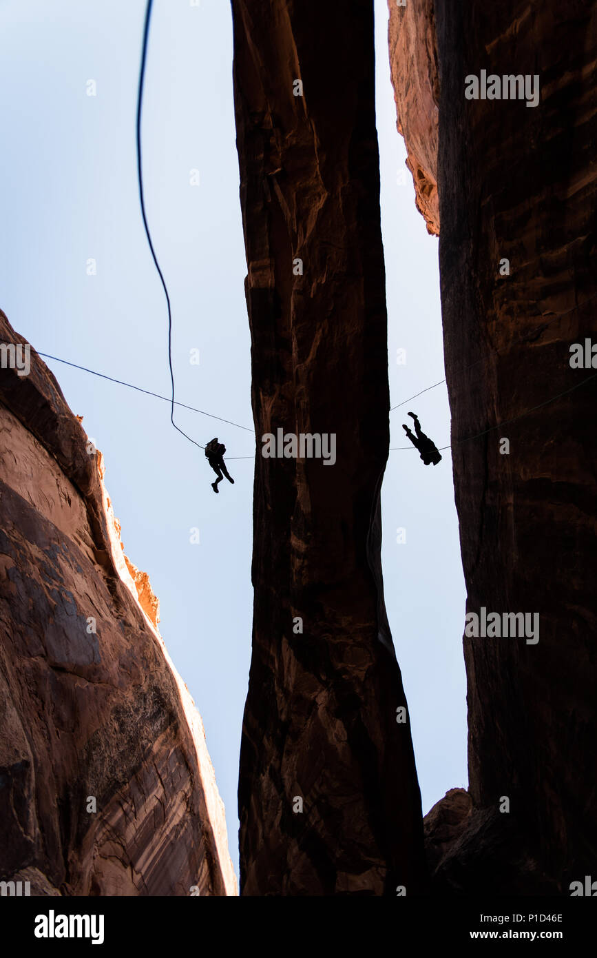 People rappelling from an arch in Moab, Utah Stock Photo - Alamy