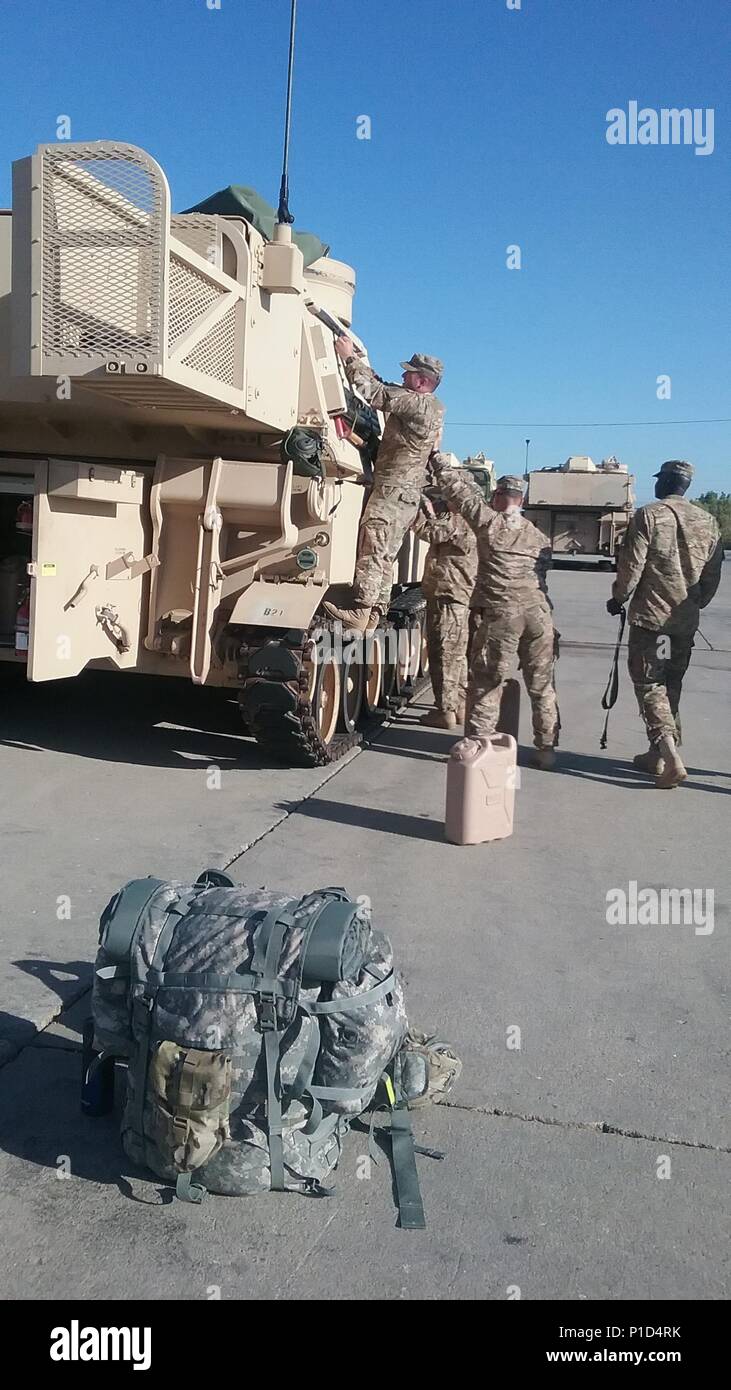 Soldiers prepare their rain tarps for a combat rollout on Oct. 5 at the ...