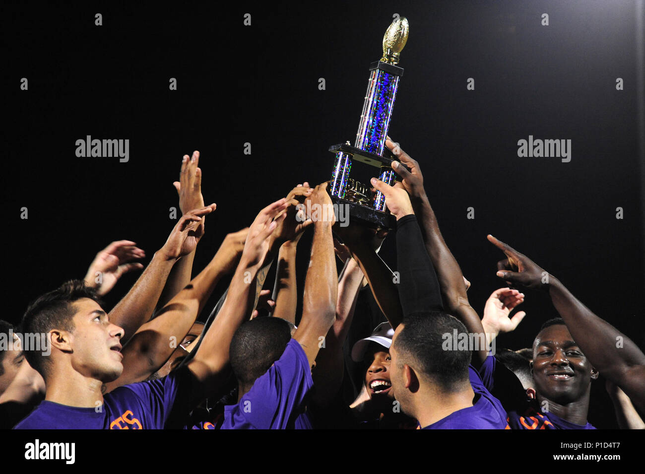 Members of the 509th Security Forces Squadron (SFS) hold up the ...