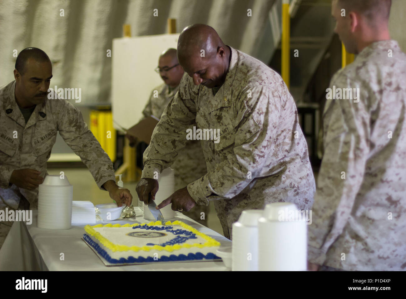 Lieutenant commander Arthur L. Wiggins Jr. cuts the 241st anniversary ...
