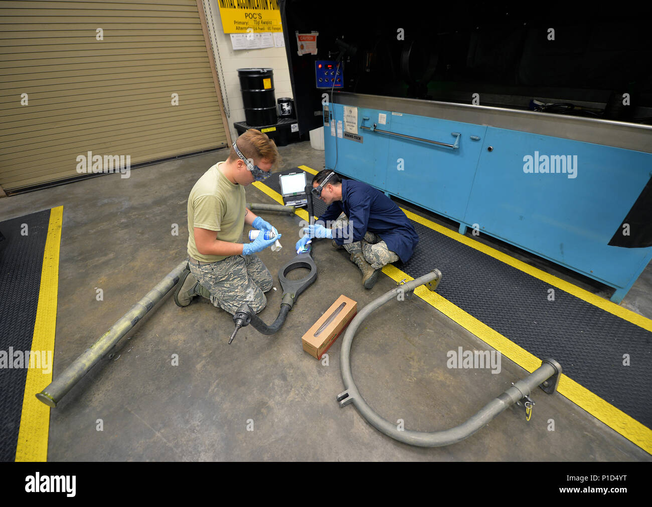 Airman 1st Class Julian Flanagan and Airman 1st Class Brian Sheldon ...