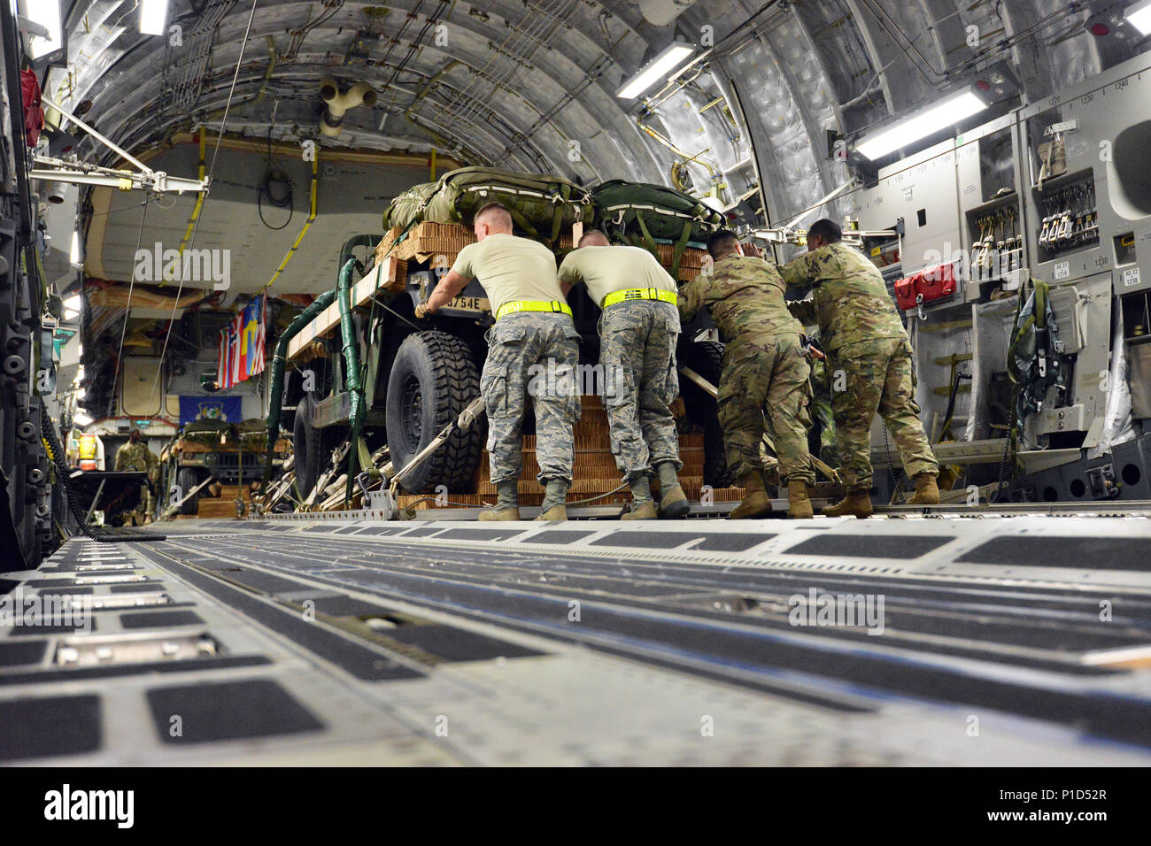Two HMMWVs of the 173rd Airborne Brigade are rigged for heavy parachute ...