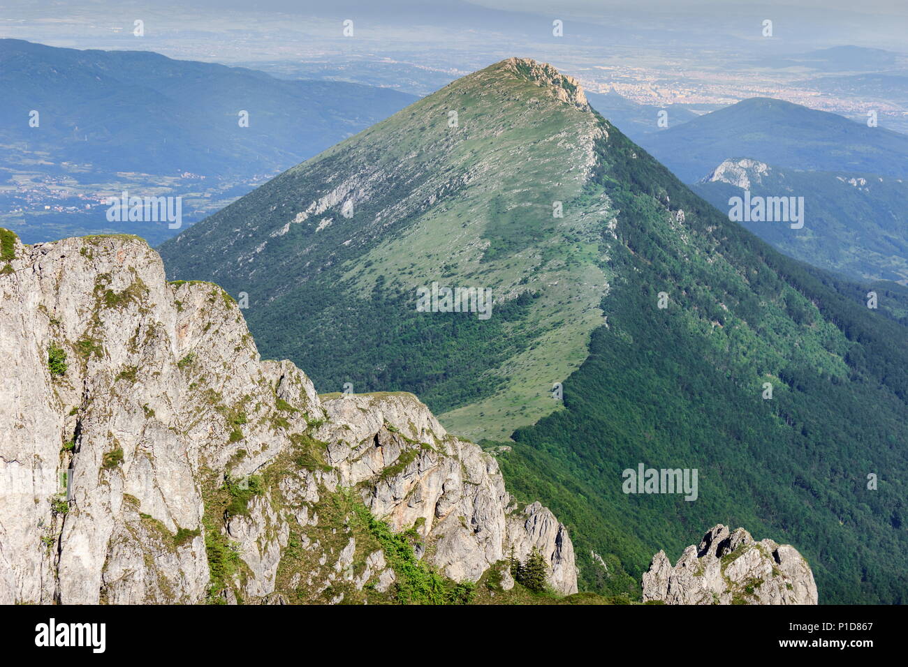 View of Falcon rock summit and distant city of Nis from Trem summit ...