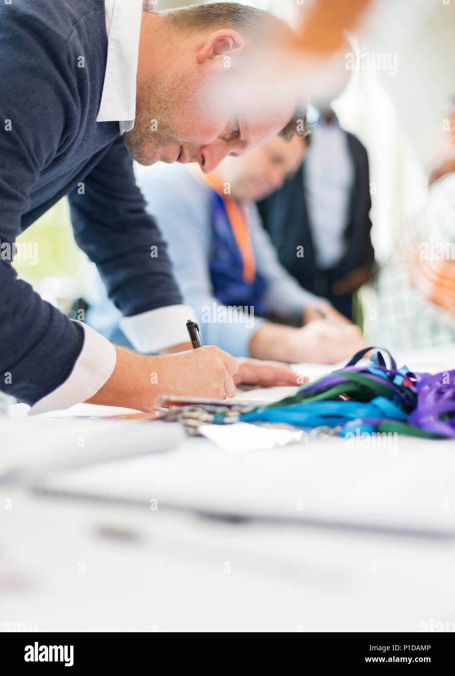 Conference registration table hi-res stock photography and images - Alamy