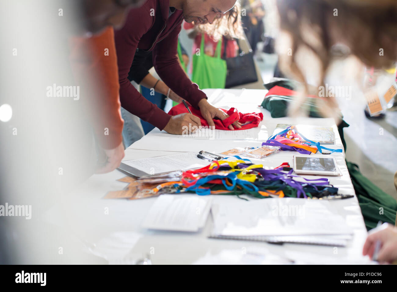 Conference registration table hi-res stock photography and images - Alamy