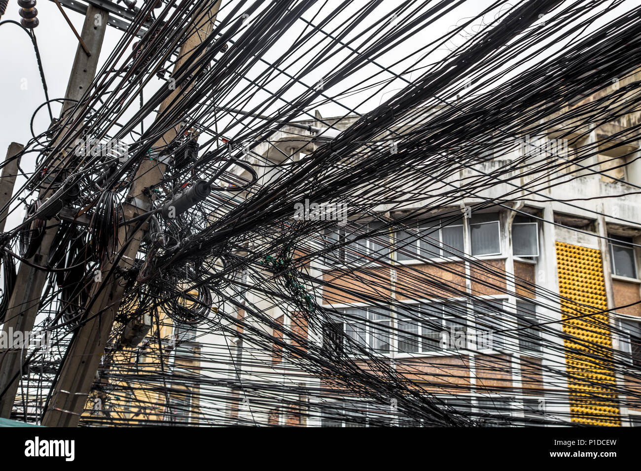 Messy wires attached electric pole hi-res stock photography and images ...