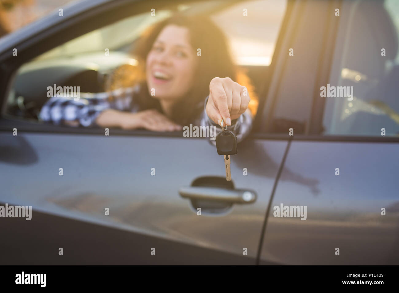 Young Happy Woman Showing The Key Of New Car Stock Photo - Alamy