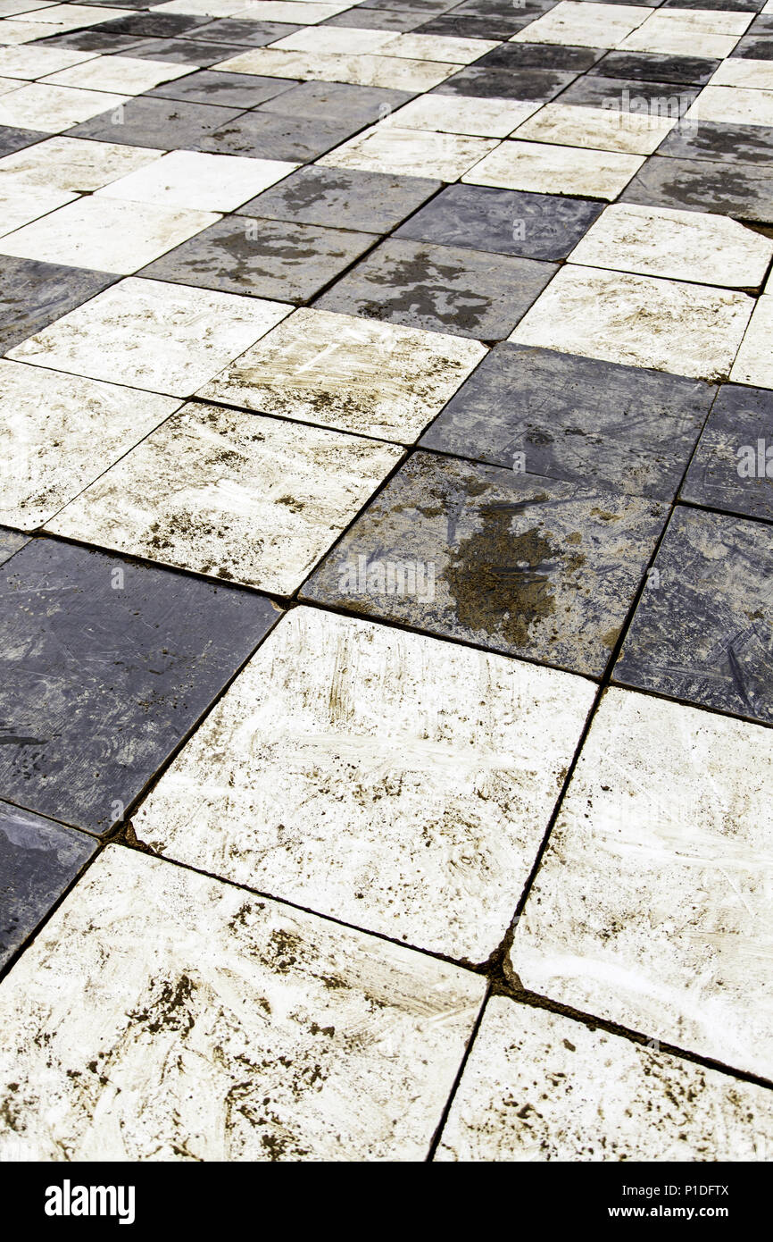 Old floor with chess squares, decoration detail in black and white ...