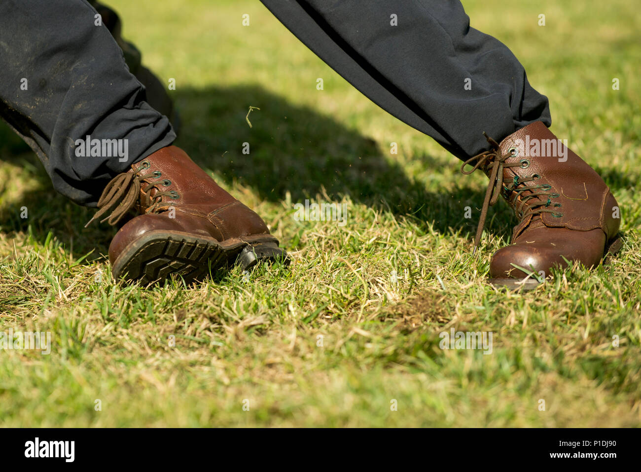 man pulling a rope tug of war. And fight shoes Stock Photo - Alamy
