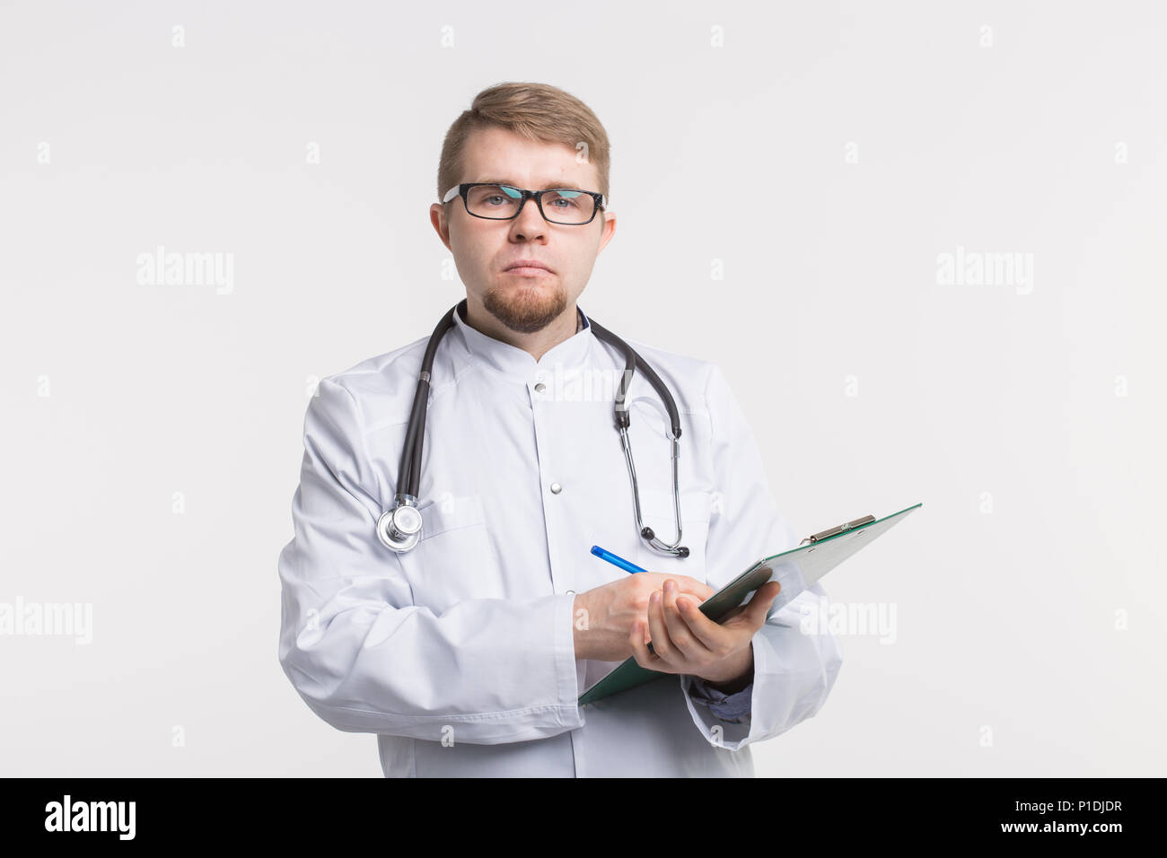 Medical doctor writing prescription over white background Stock Photo ...