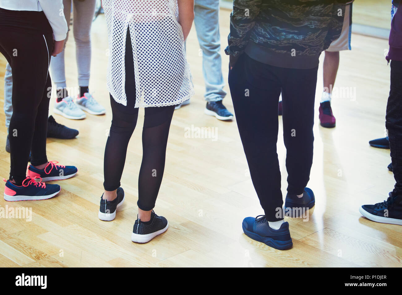 Teenage students standing in circle in dance class studio Stock Photo ...