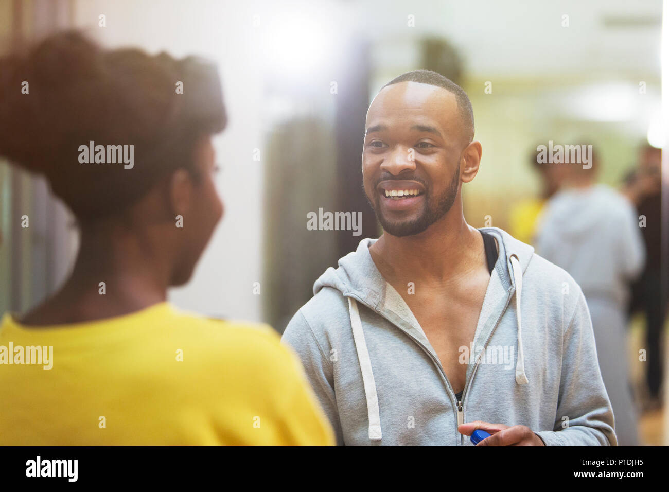 Smiling dancers talking in dance class studio Stock Photo - Alamy