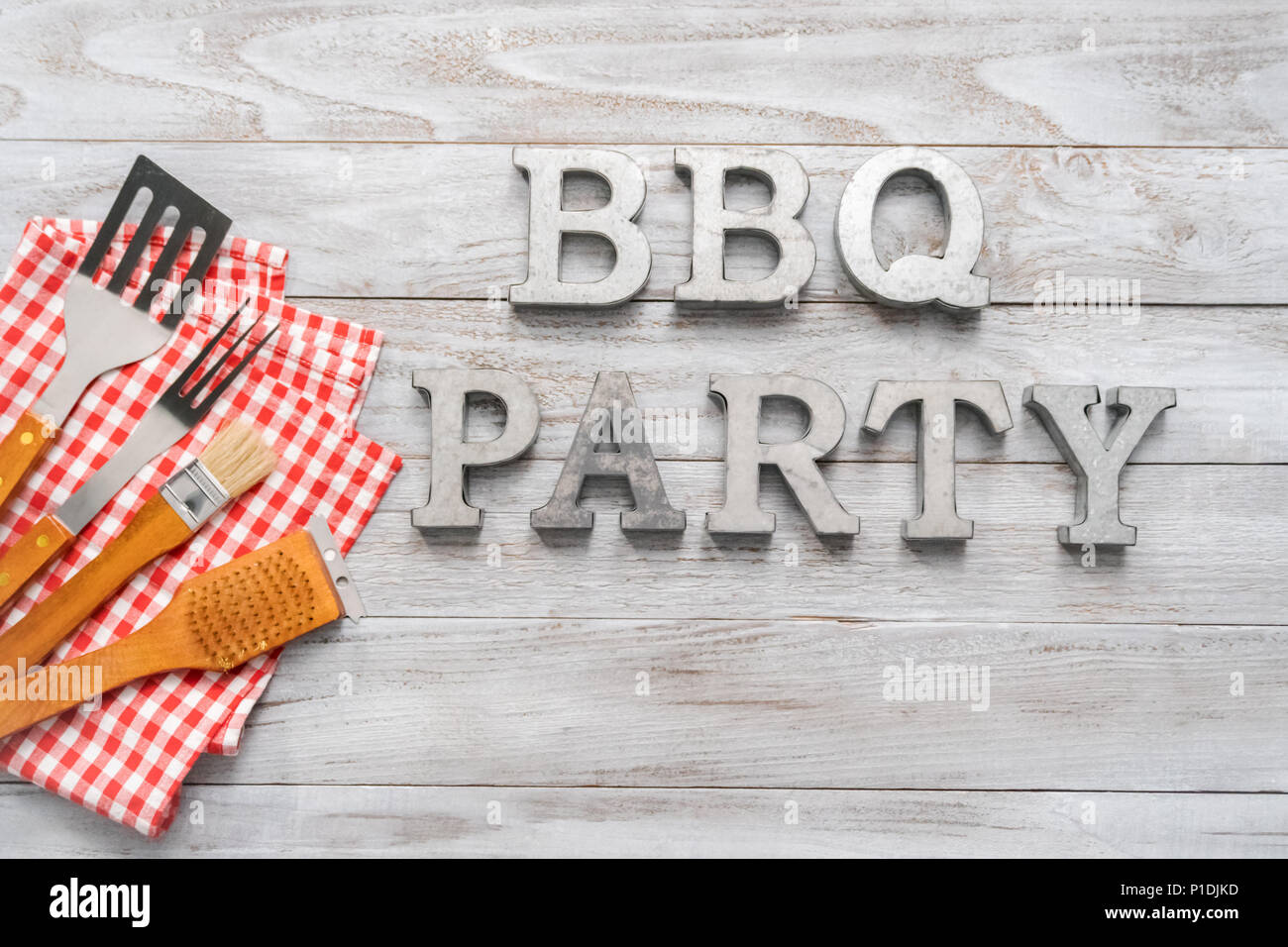 BBQ Party sign with BBQ cooking tools on a wood background Stock Photo ...