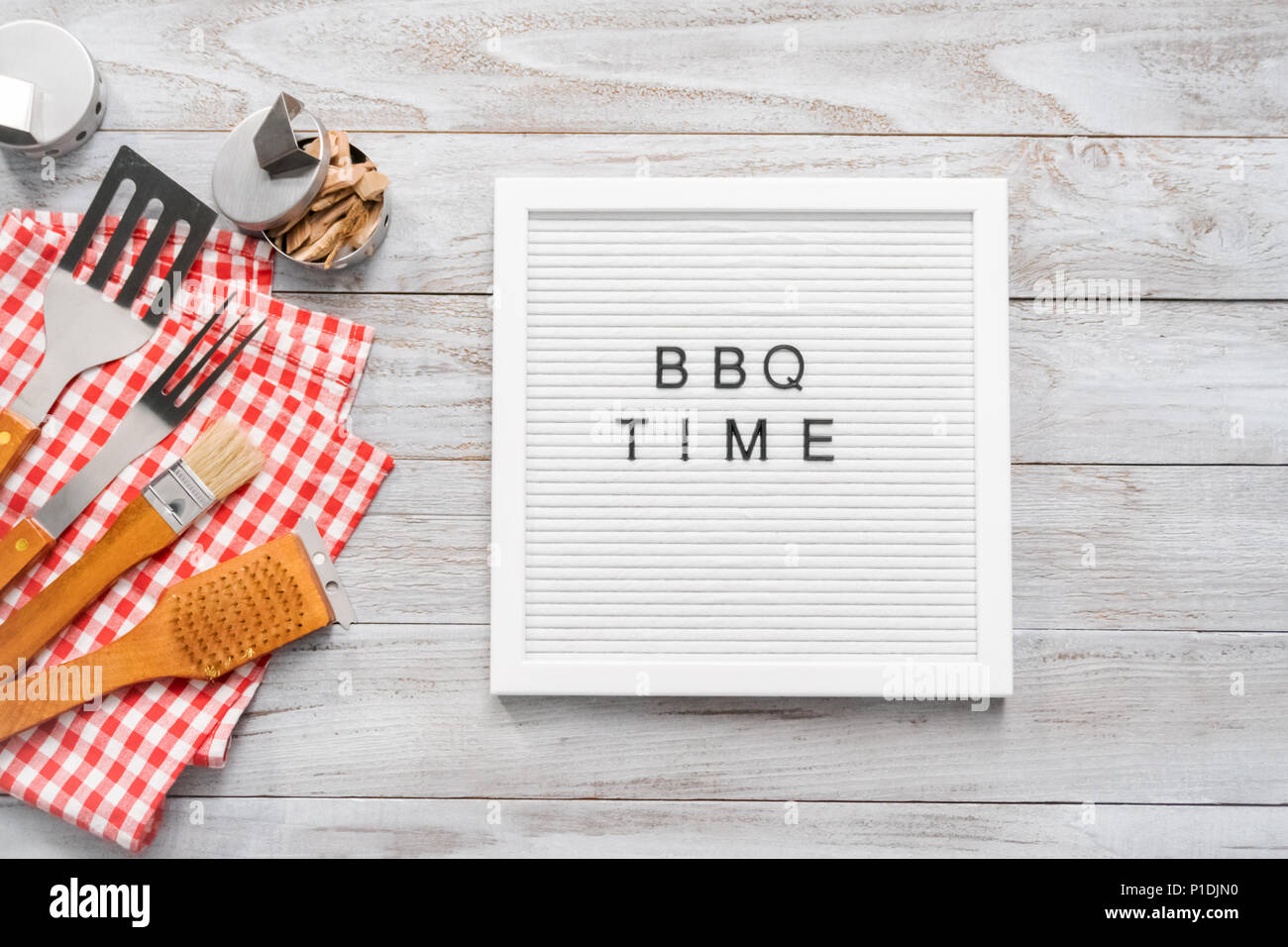 BBQ Time sign on memo board with BBQ tools Stock Photo - Alamy