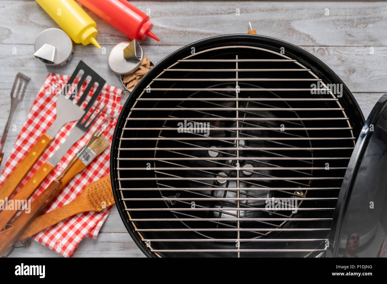 Background with BBQ cooking tools on wood background Stock Photo - Alamy