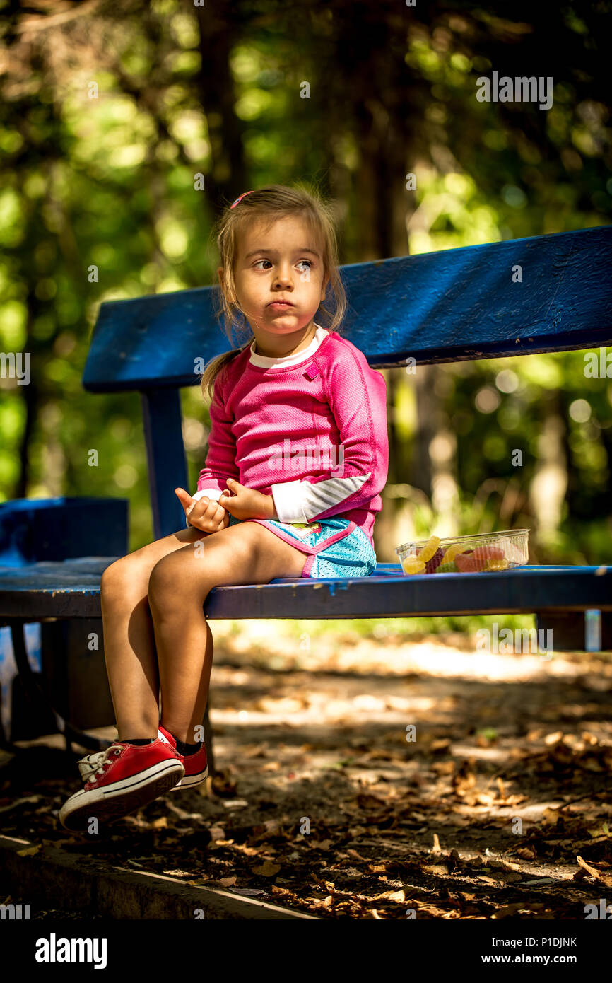 Girl Sitting On A Bench