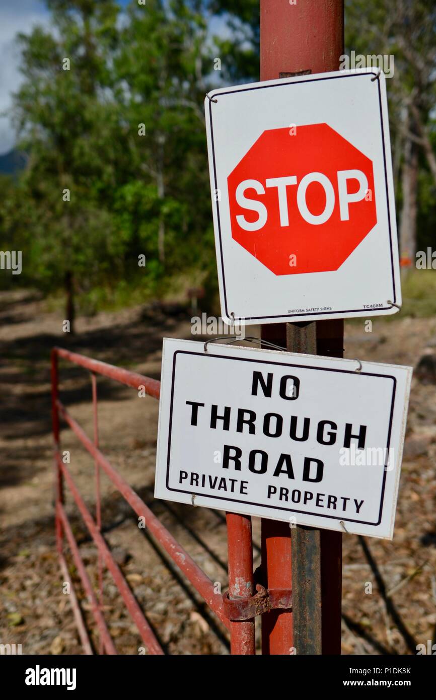 Stop and private property sign on a fence with a gate, Paluma Range ...