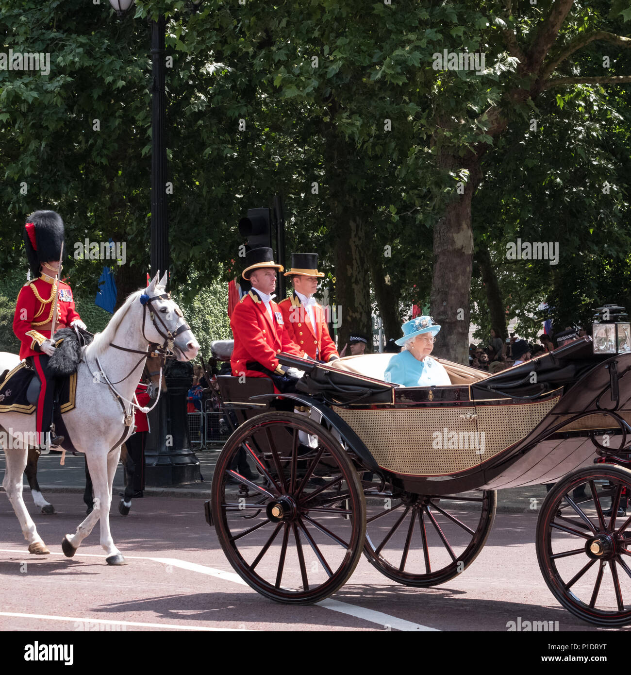 Queen Elizabeth II travels along The Mall, London in an open top horse ...