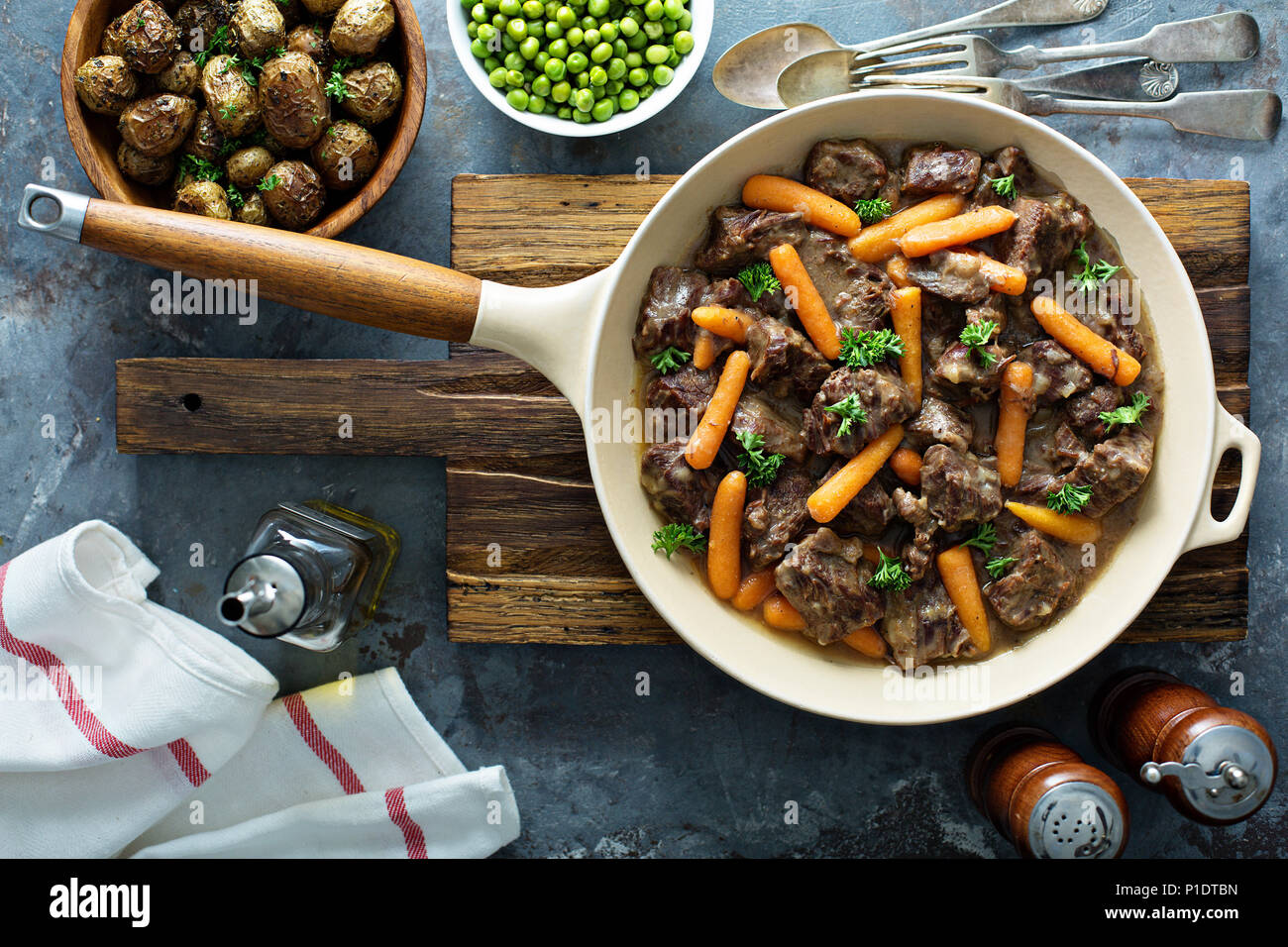 Beef stew with carrots and parsley Stock Photo - Alamy