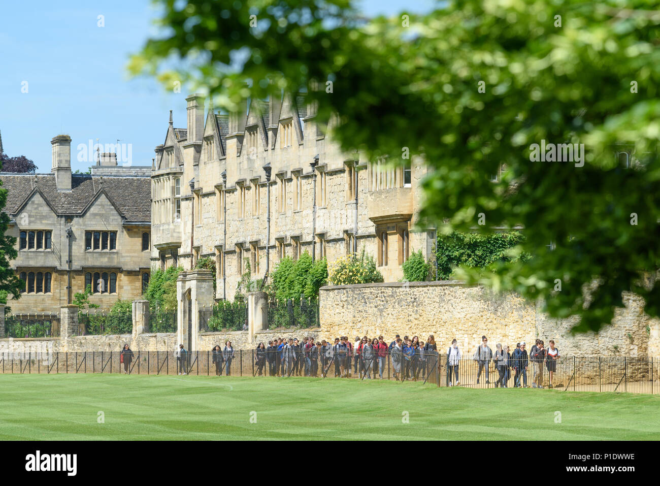 A school party of children walk along Deadman's walk, between Merton ...