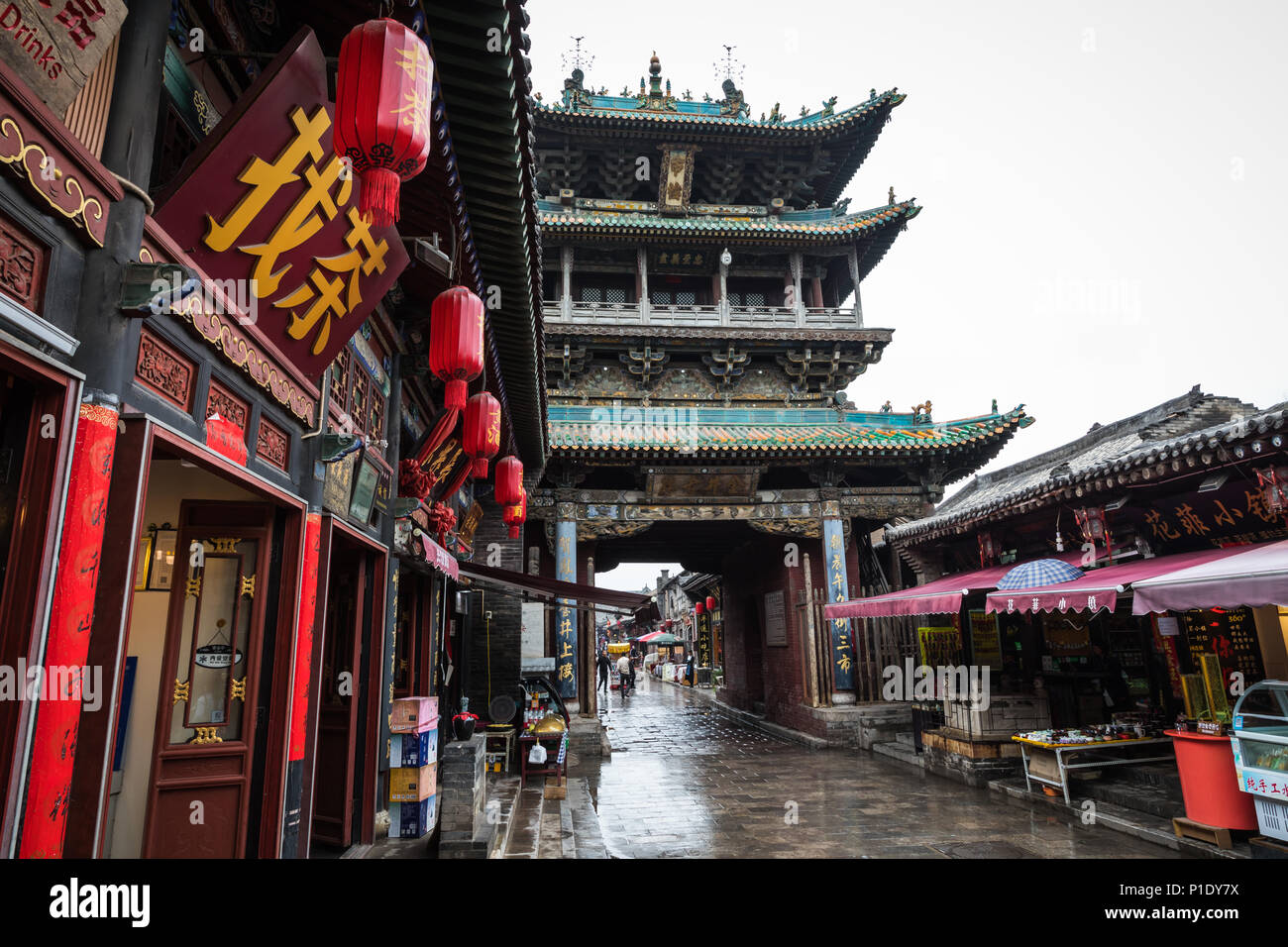 PINGYAO, CHINA - MAY 21, 2018: Tourists and local people in the ancient ...