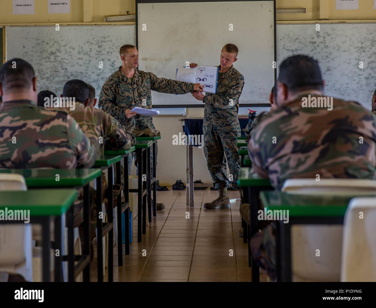 TALIAI, Tonga – U.S. Marine Sgt. Brier Avara, left, a military police ...