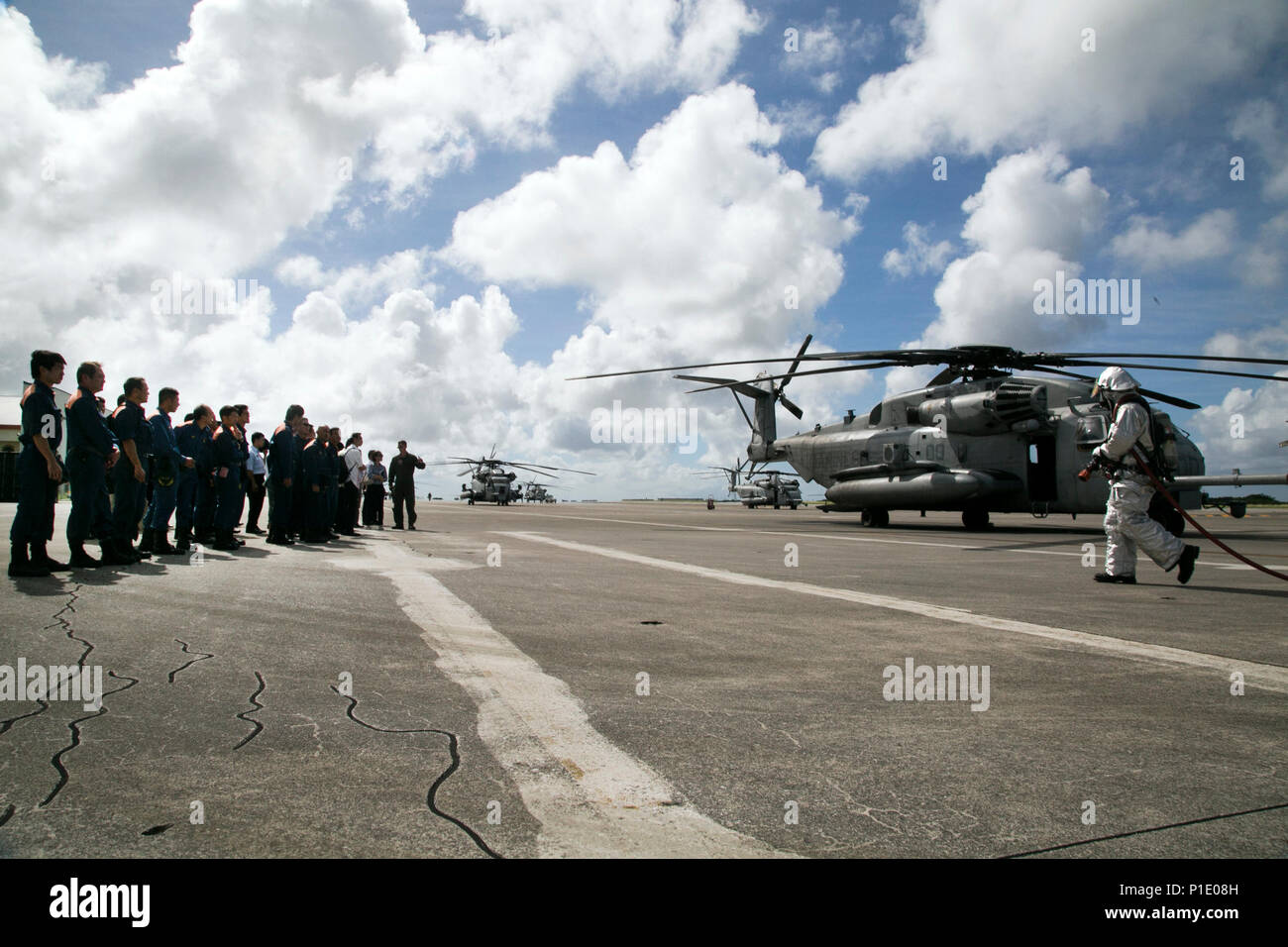 Urasoe City and Ginowan fire departments observe as an aircraft rescue ...