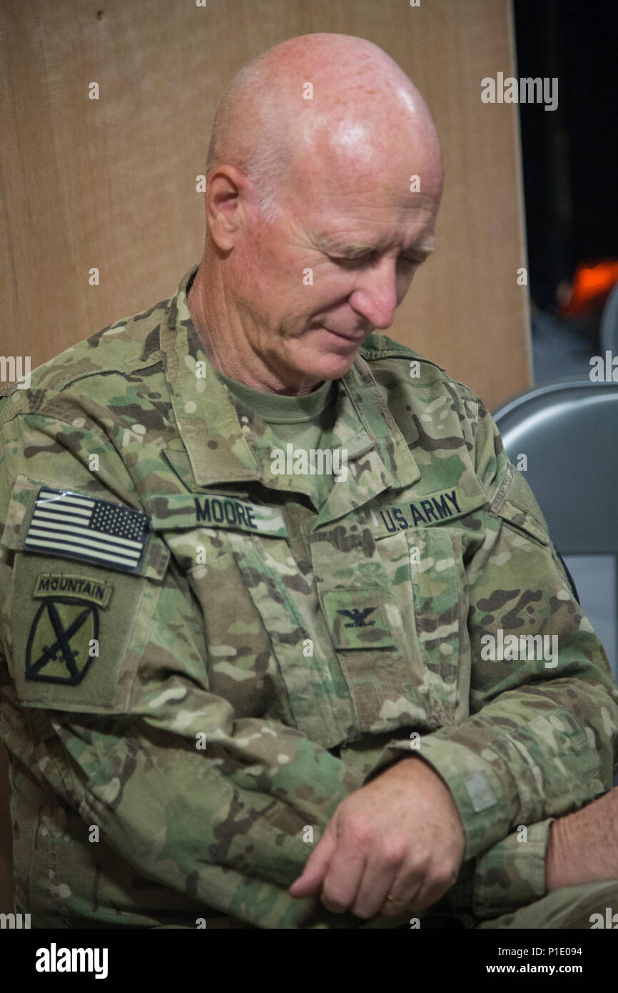 U.S. Army Col. Kelly Moore, the XVIII Airborne Corps Chaplain, bows his ...