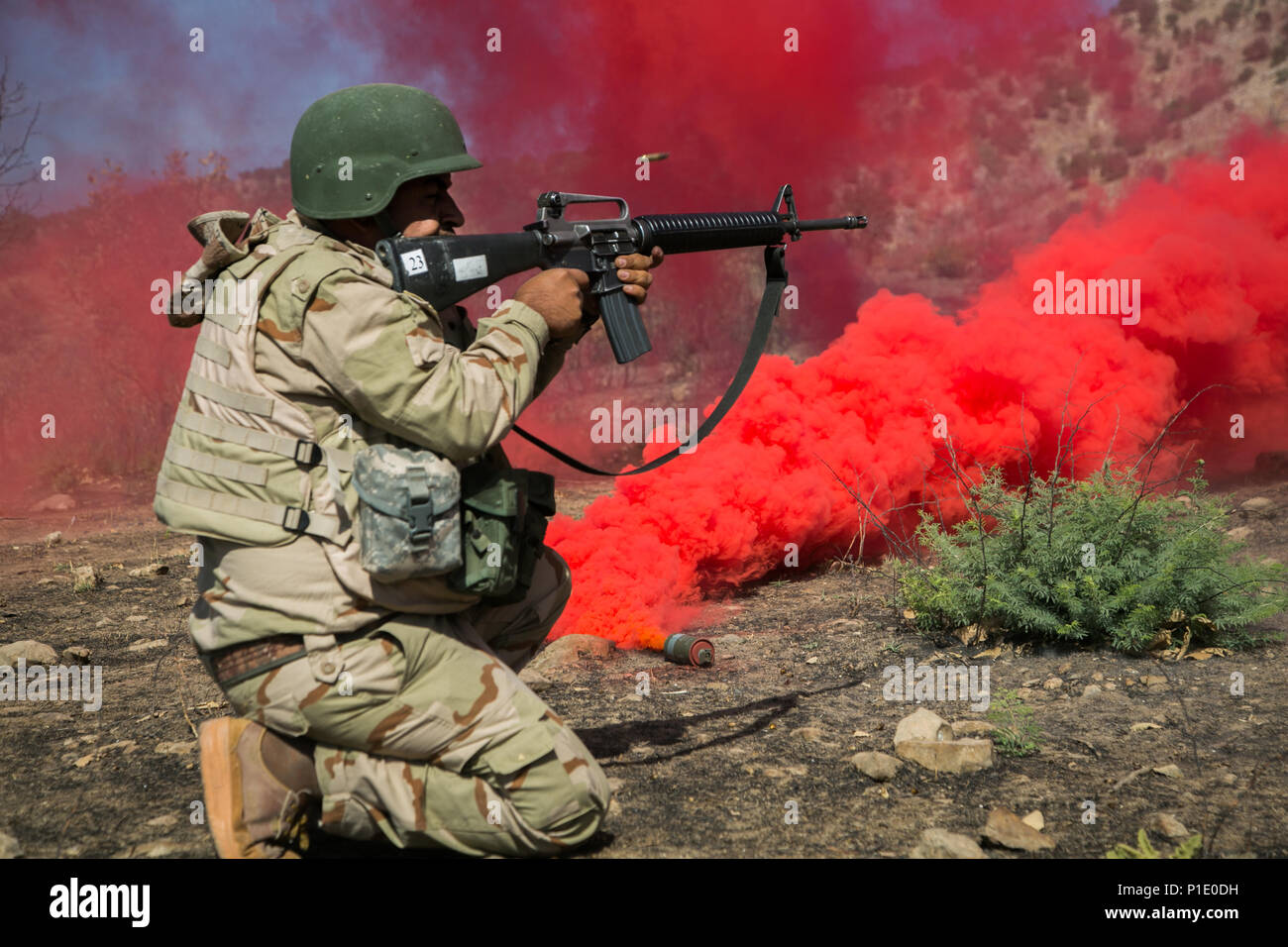 A Peshmerga soldier fires his M16 rifle during the Modern Brigade ...