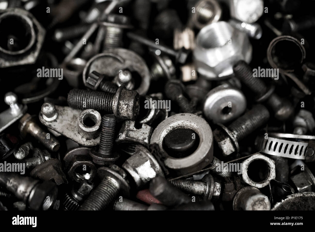 Close-up of used steel bolts background Stock Photo - Alamy