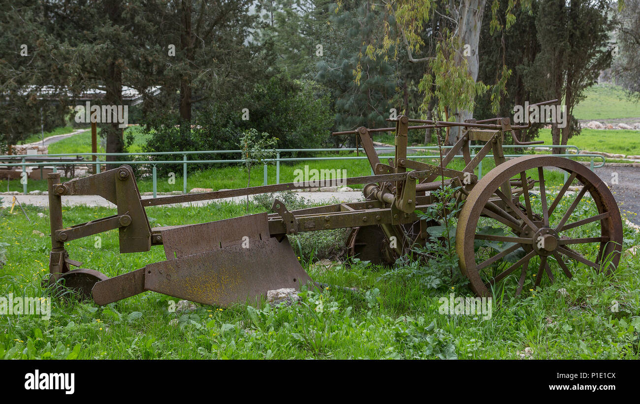 Ancient, rusty farm machine stands on the farm as a monument Stock ...