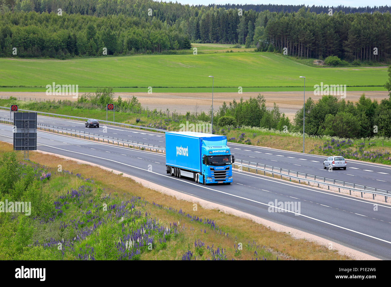 Scania semi trailer of FE-Trans for PostNord Logistics hauls load on ...