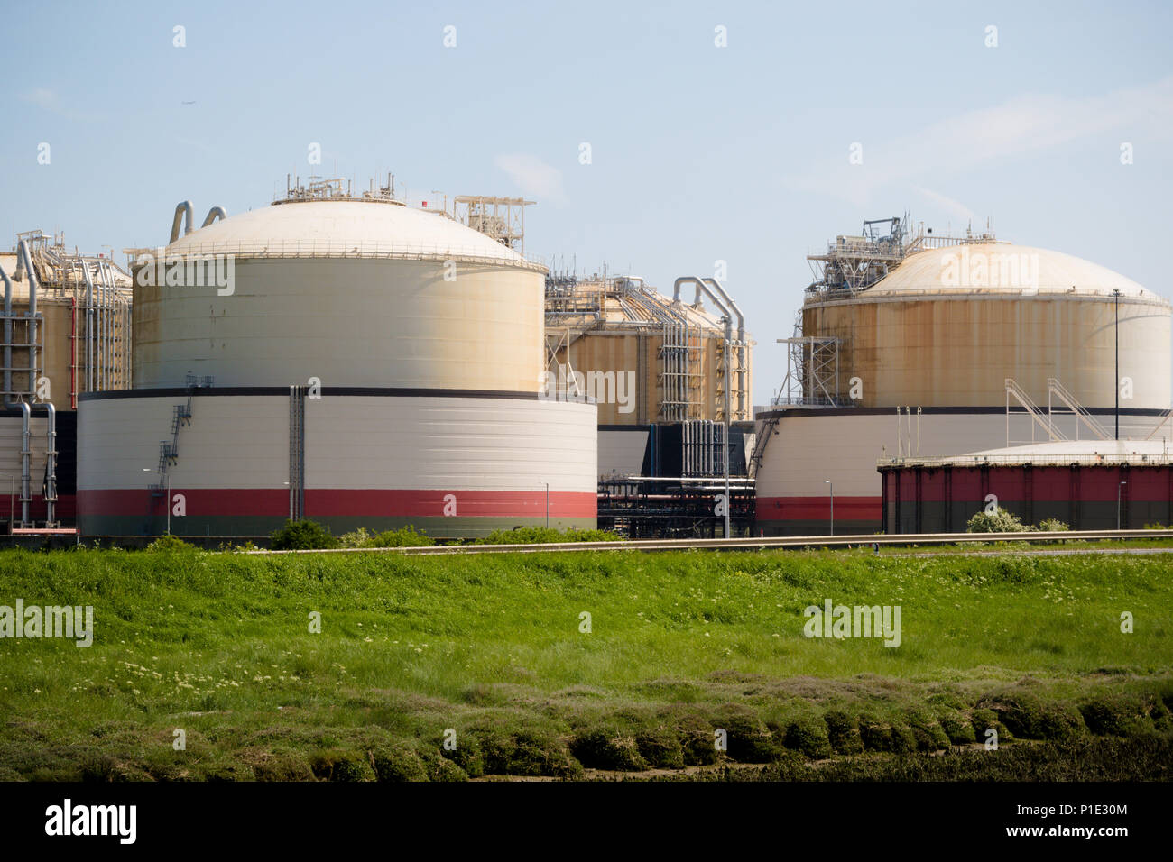 Storage tanks for LNG on the Isle of Grain, Kent, UK Stock Photo - Alamy